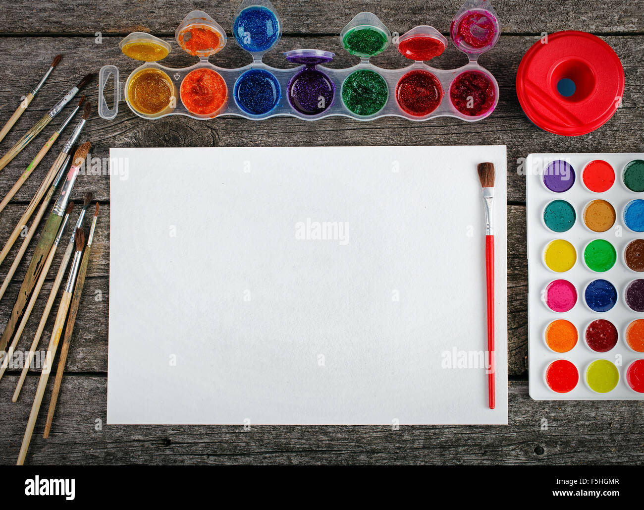 Watercolor paints set with brushes and paper sheet Stock Photo - Alamy