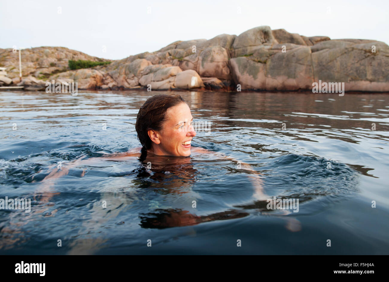 Woman swimming outdoors hi-res stock photography and images - Alamy