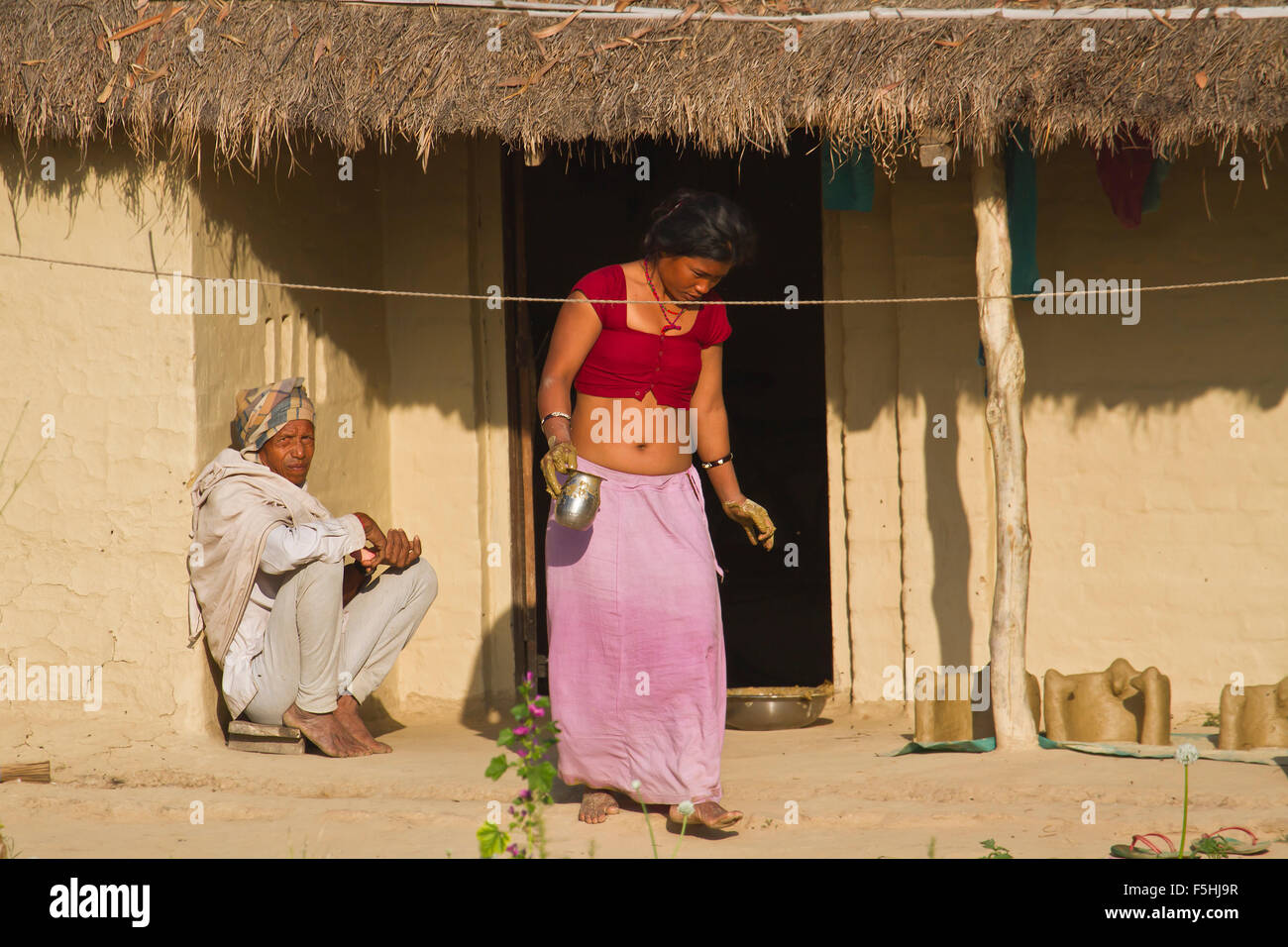 Couple of Tharu people in traditional adobe house in terai, Nepal Stock ...