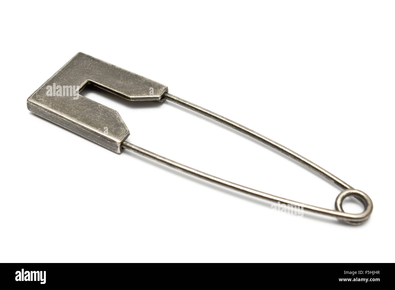 Old safety pin isolated on white Stock Photo - Alamy