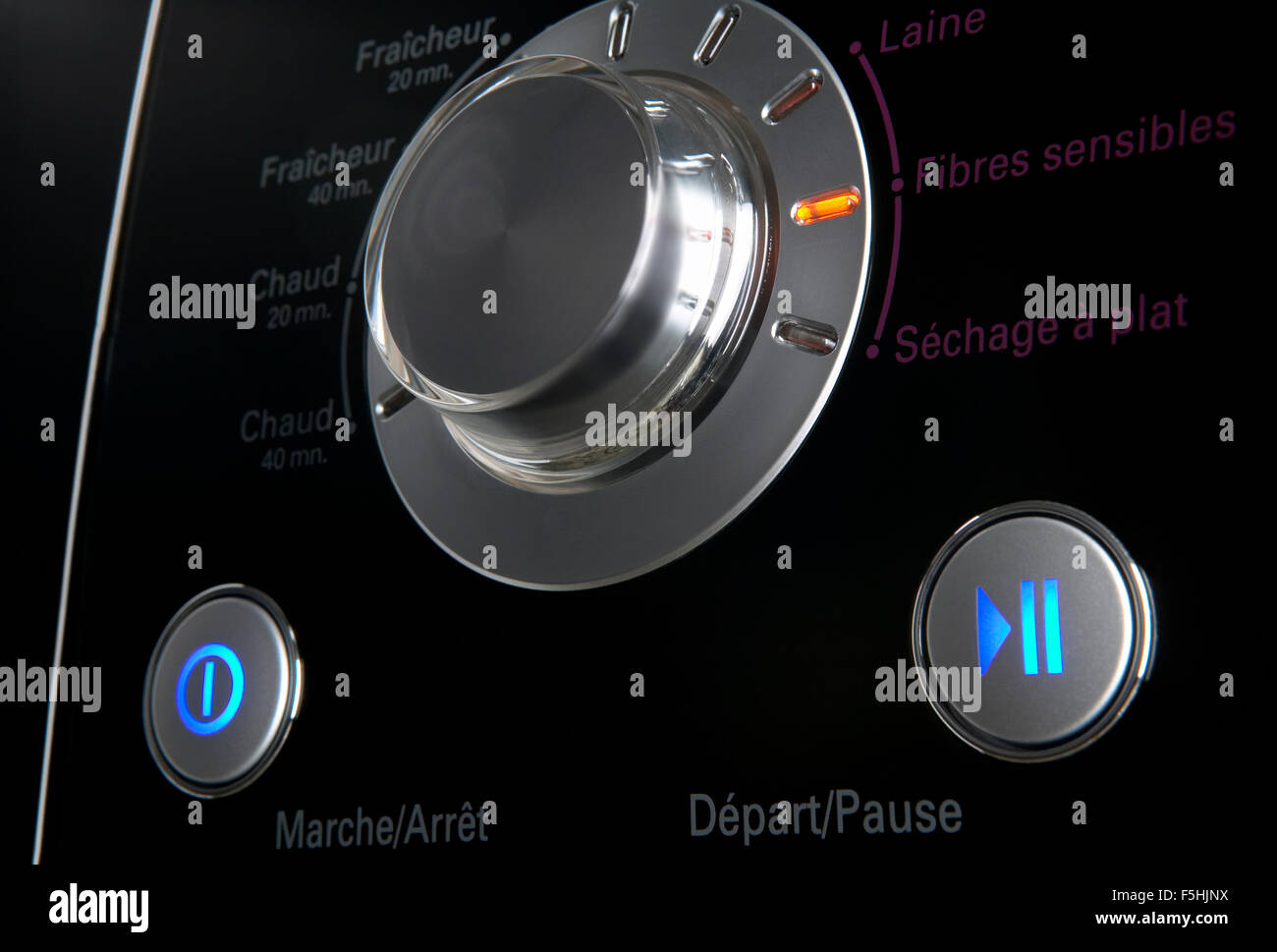 Close up of a modern washing machine control dashboard, with timer and ...
