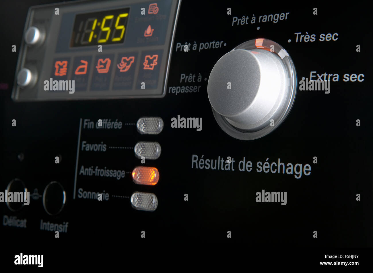 Close up of a modern washing machine control dashboard, with timer and ...