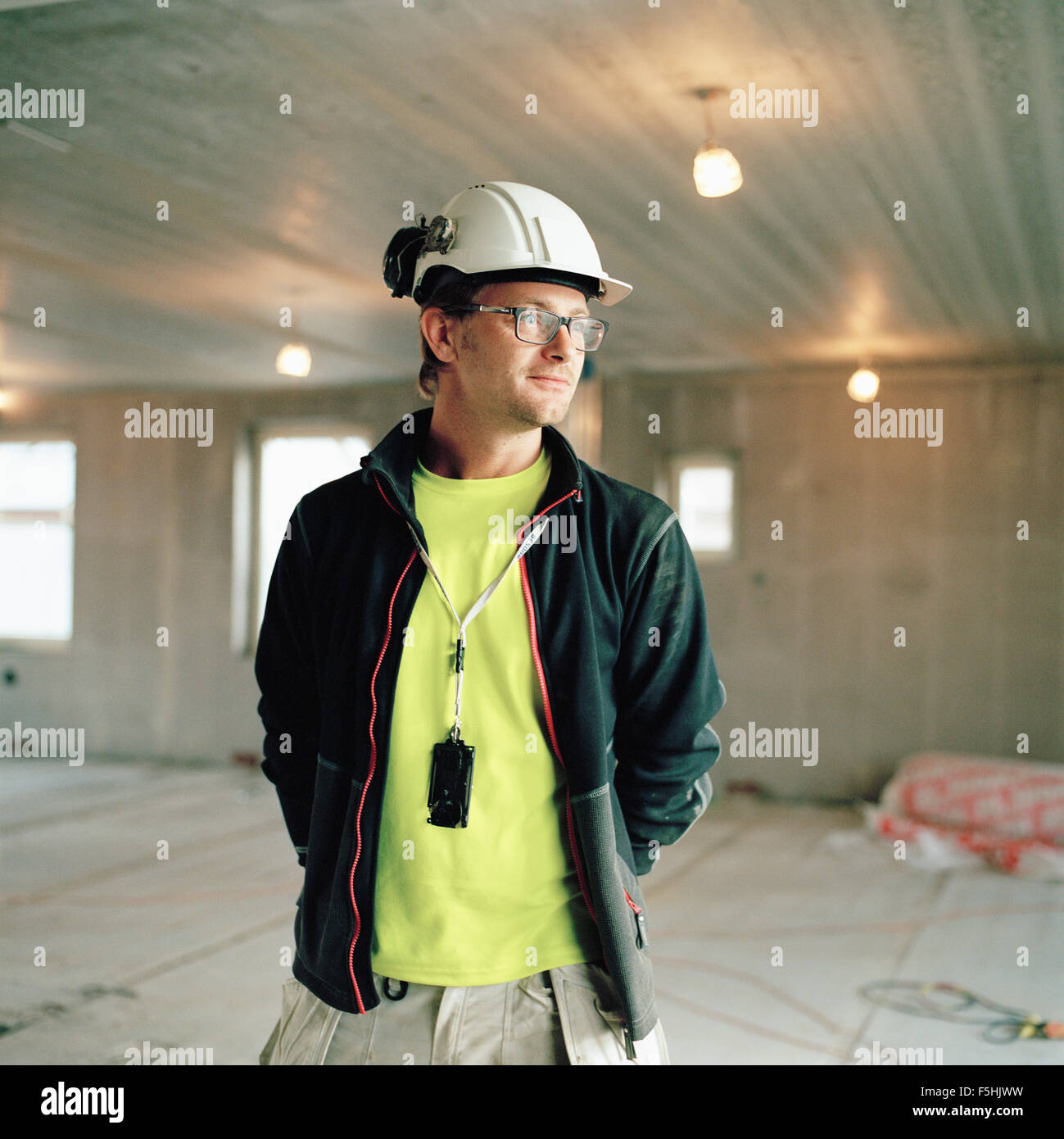 Sweden, Mid-adult construction worker looking away Stock Photo - Alamy