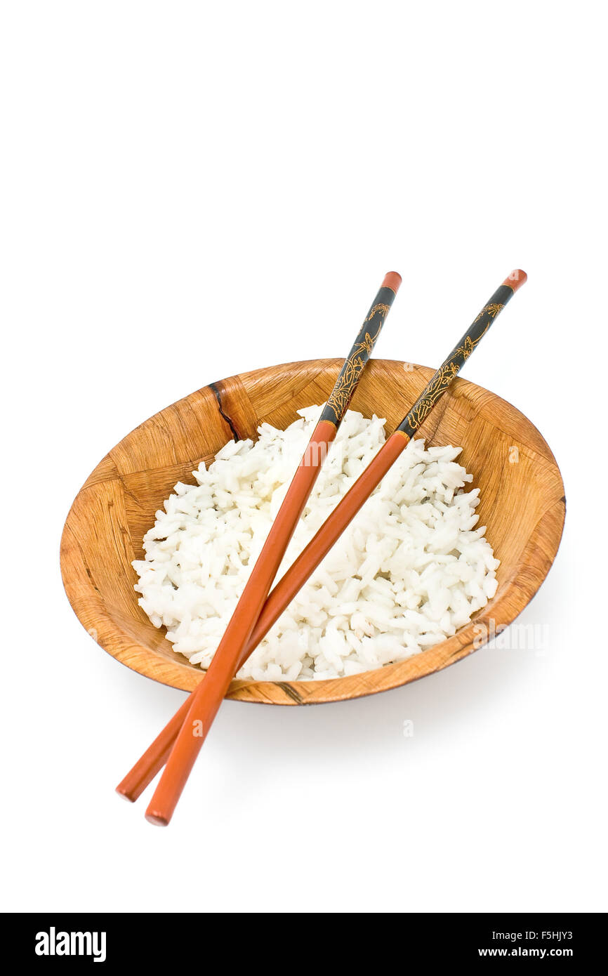 Bamboo bowl with rice and chopsticks isolated on white Stock Photo - Alamy