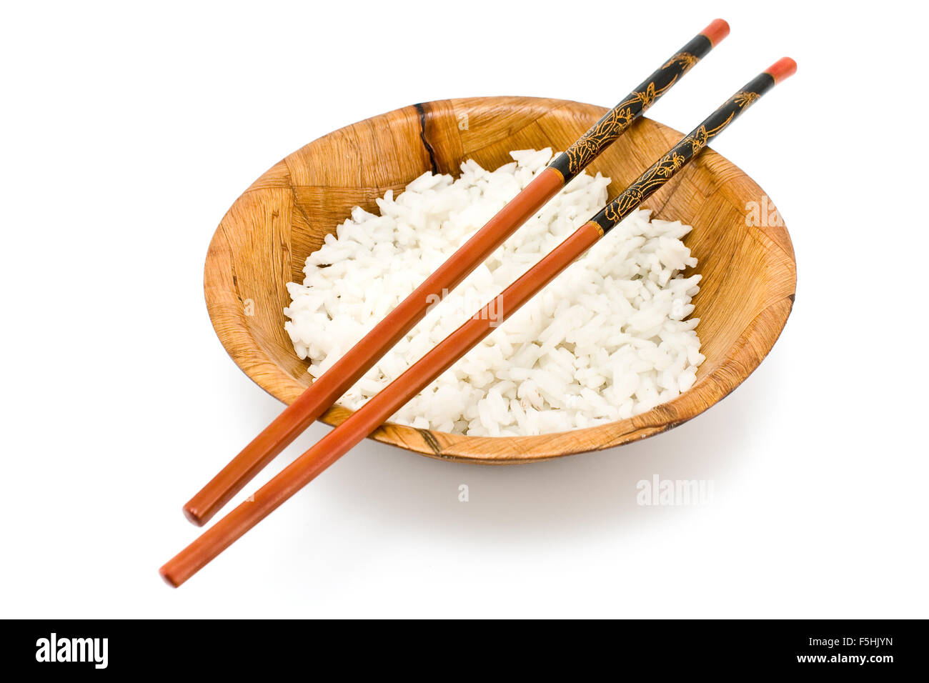 Bamboo bowl with rice and chopsticks isolated on white Stock Photo - Alamy