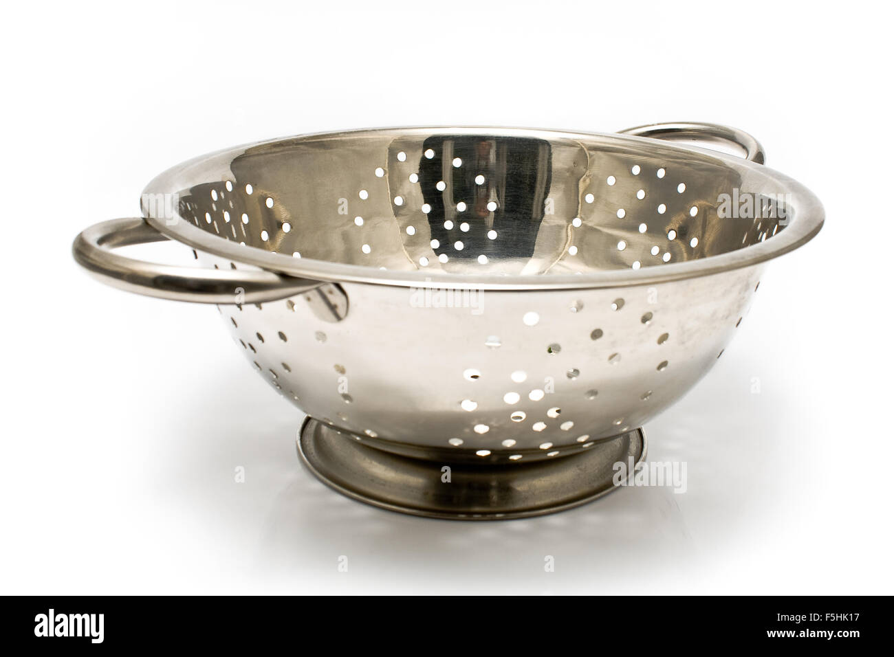 Chrome strainer on a white background Stock Photo - Alamy