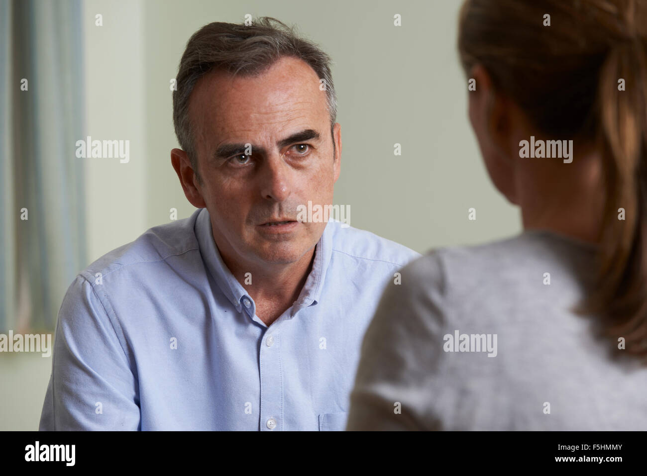 Depressed Mature Man Talking To Counsellor Stock Photo - Alamy
