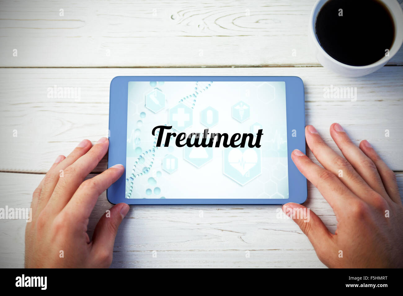 Treatment against person using tablet computer Stock Photo - Alamy