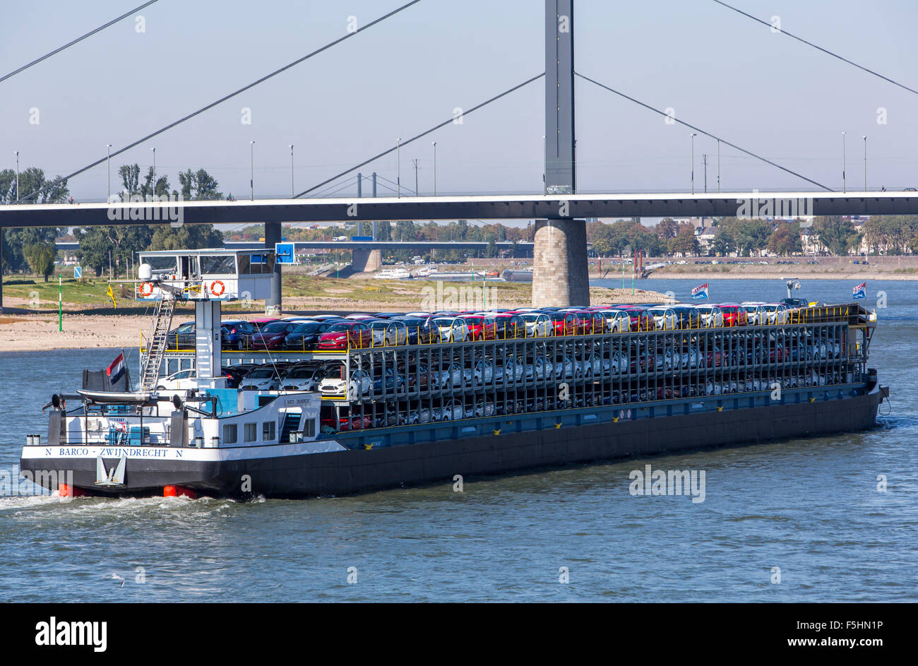 River Rhine, freight ship passing the old town area in Düsseldorf ...