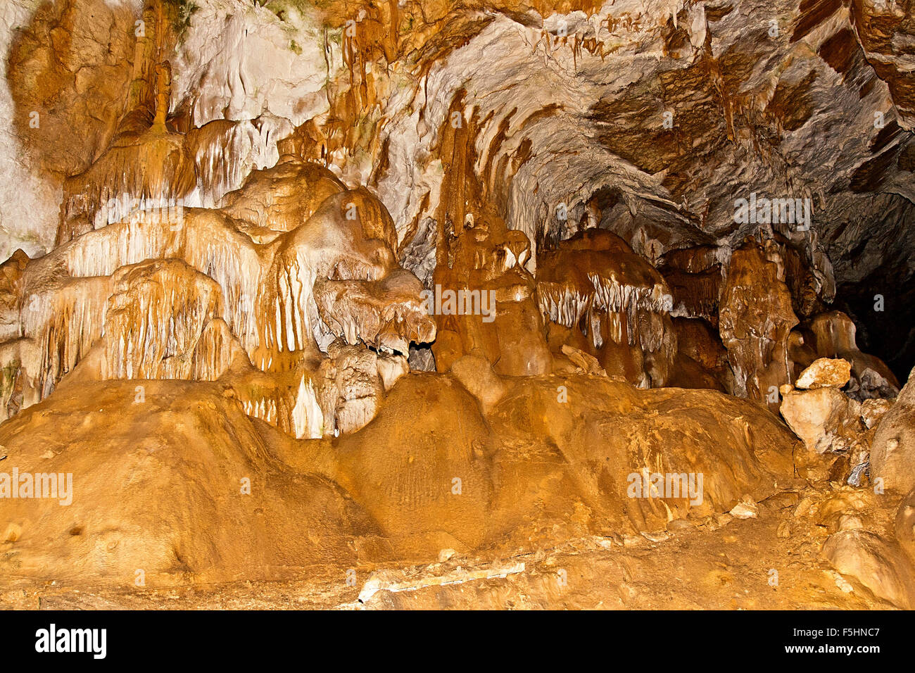 Inside view of an underground cavern or cave with stalagmites and ...