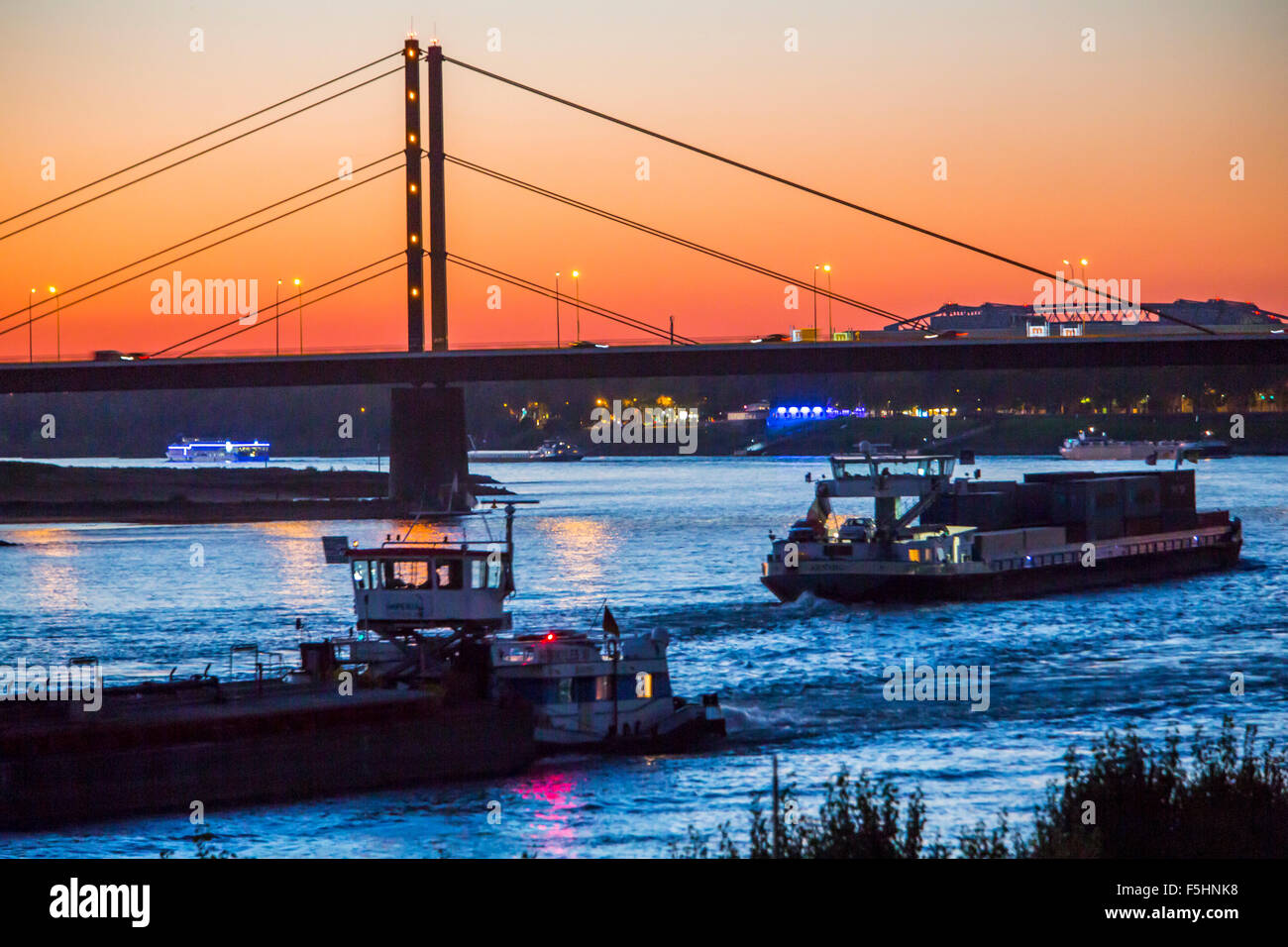 Freight ships on river Rhine in Düsseldorf, Germany, Rhine bridge ...