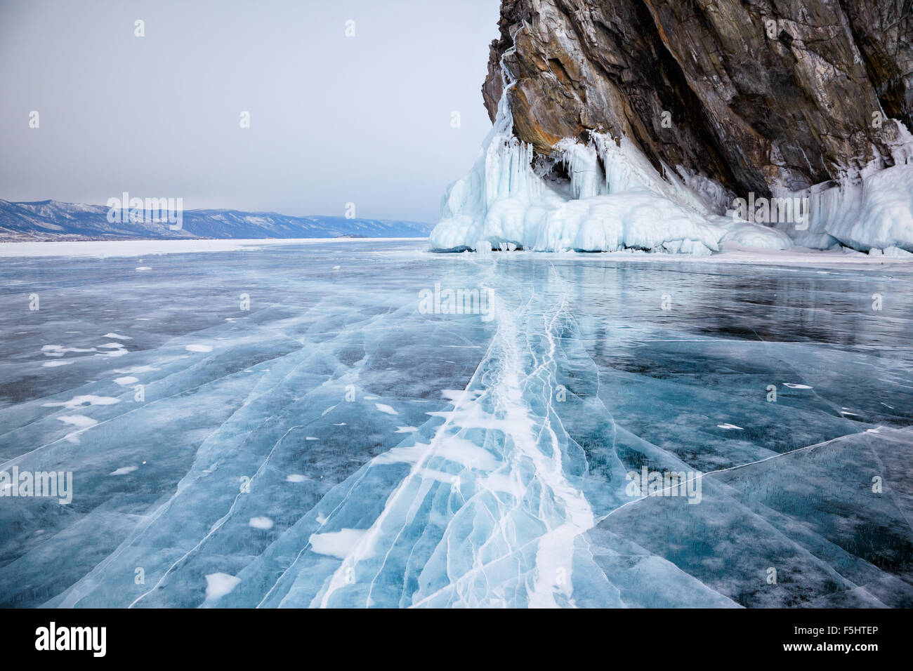 Rocks frozen into the ice of siberian Baikal Lake in winter Stock Photo ...