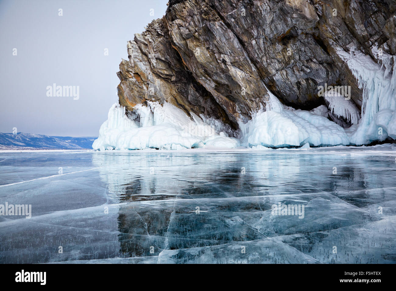 Rocks frozen into the ice of siberian Baikal Lake in winter Stock Photo ...