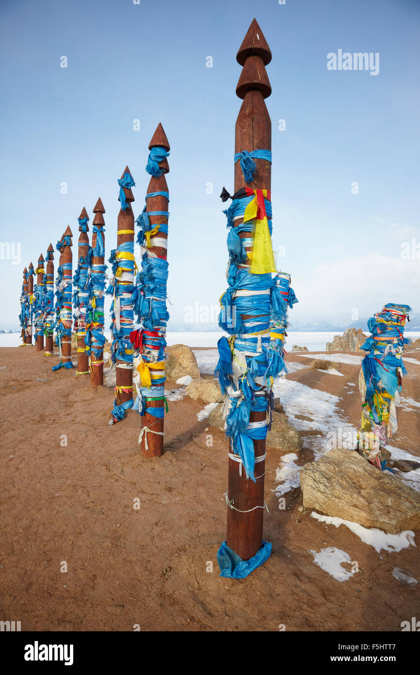 Wooden shaman totems with ribbons near holy cape Burkhan on island ...