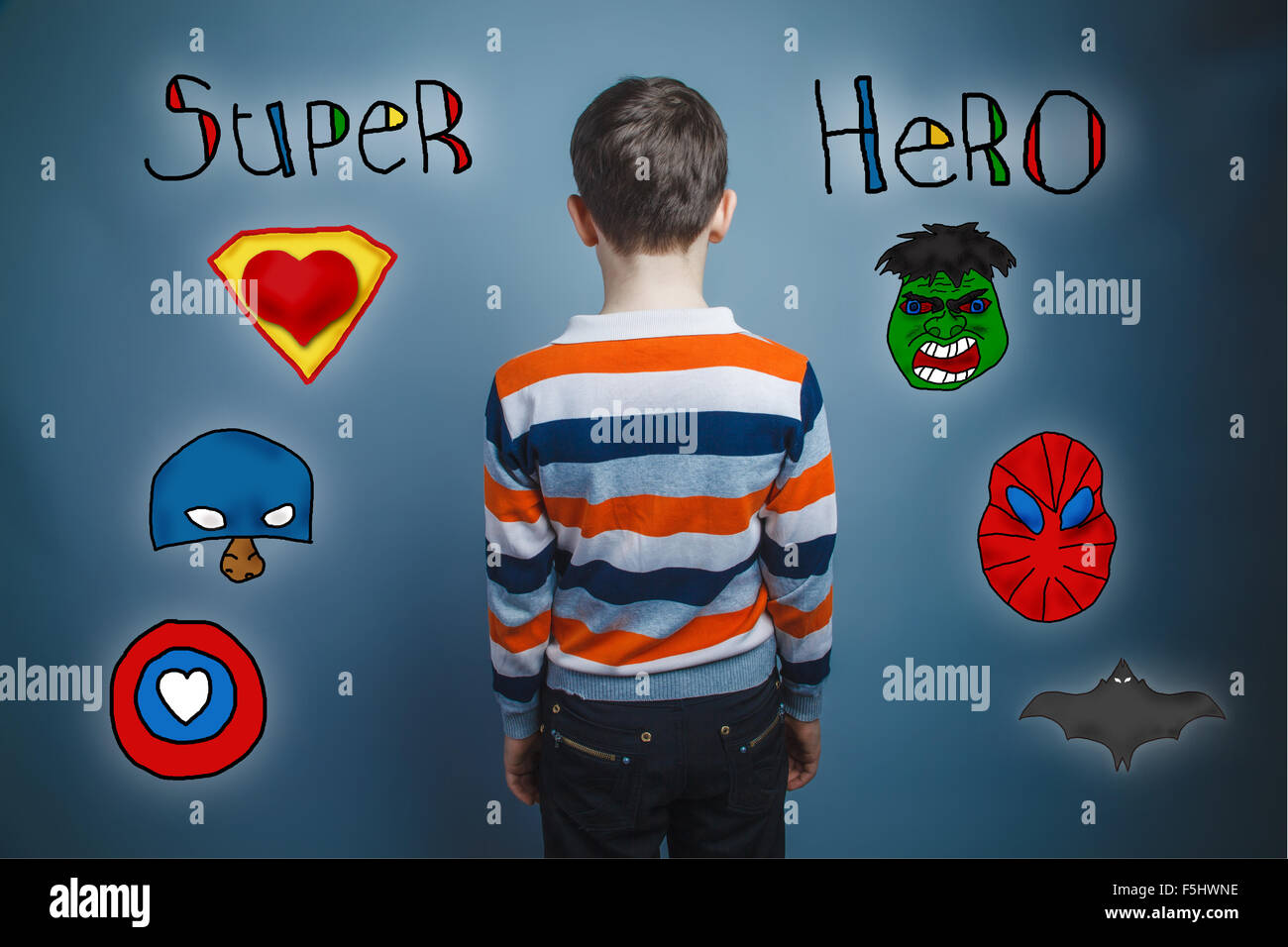 adolescent boy turned and looks ahead rear view photo superhero Stock ...