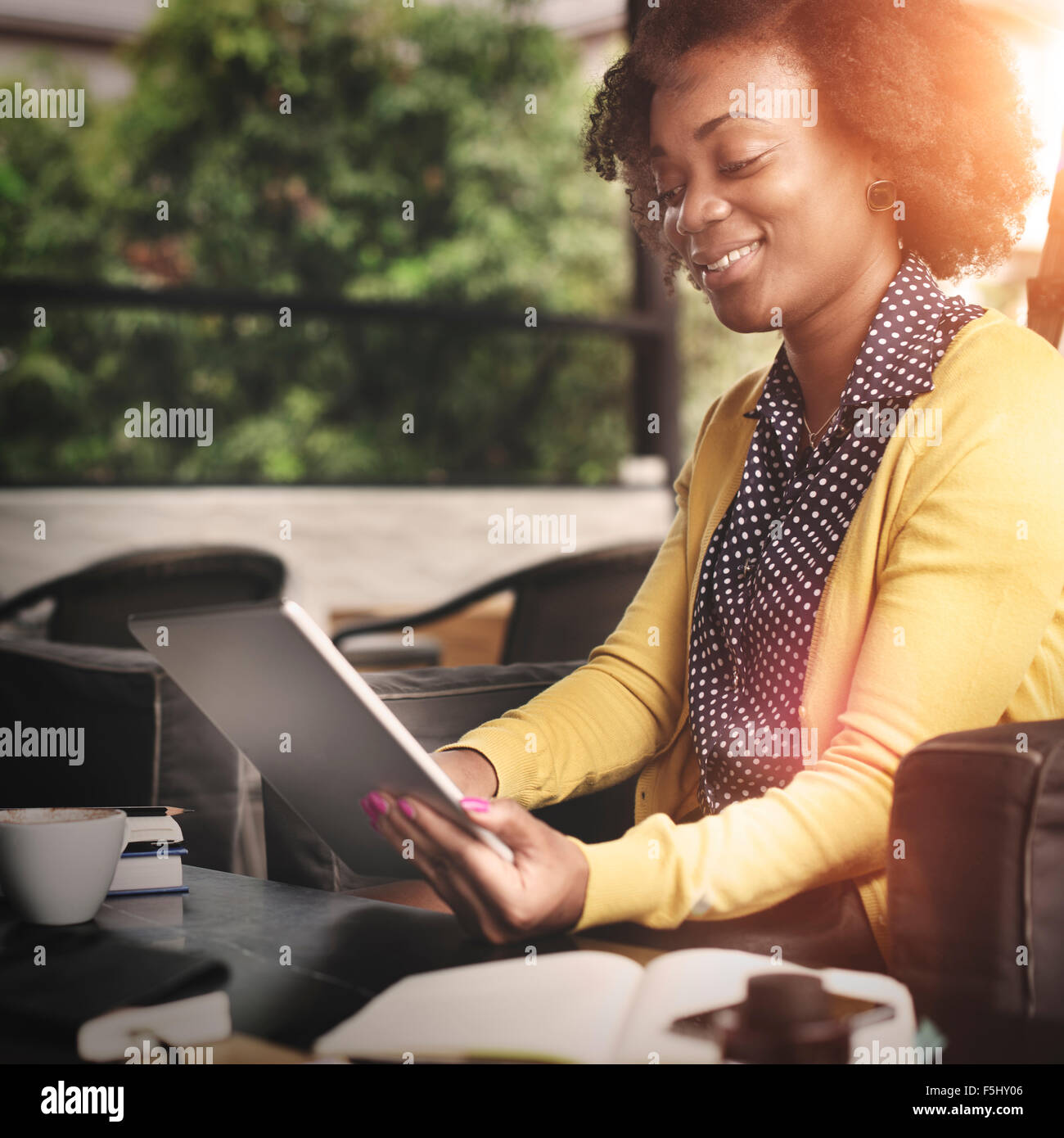 African Woman Using Tablet Relaxation Concept Stock Photo - Alamy