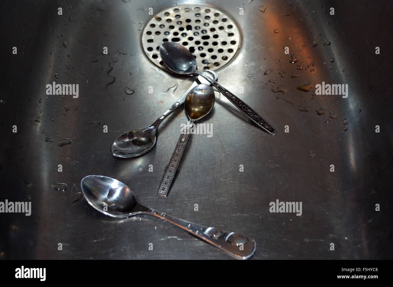 cutlery, knife and spoon in sink Stock Photo - Alamy