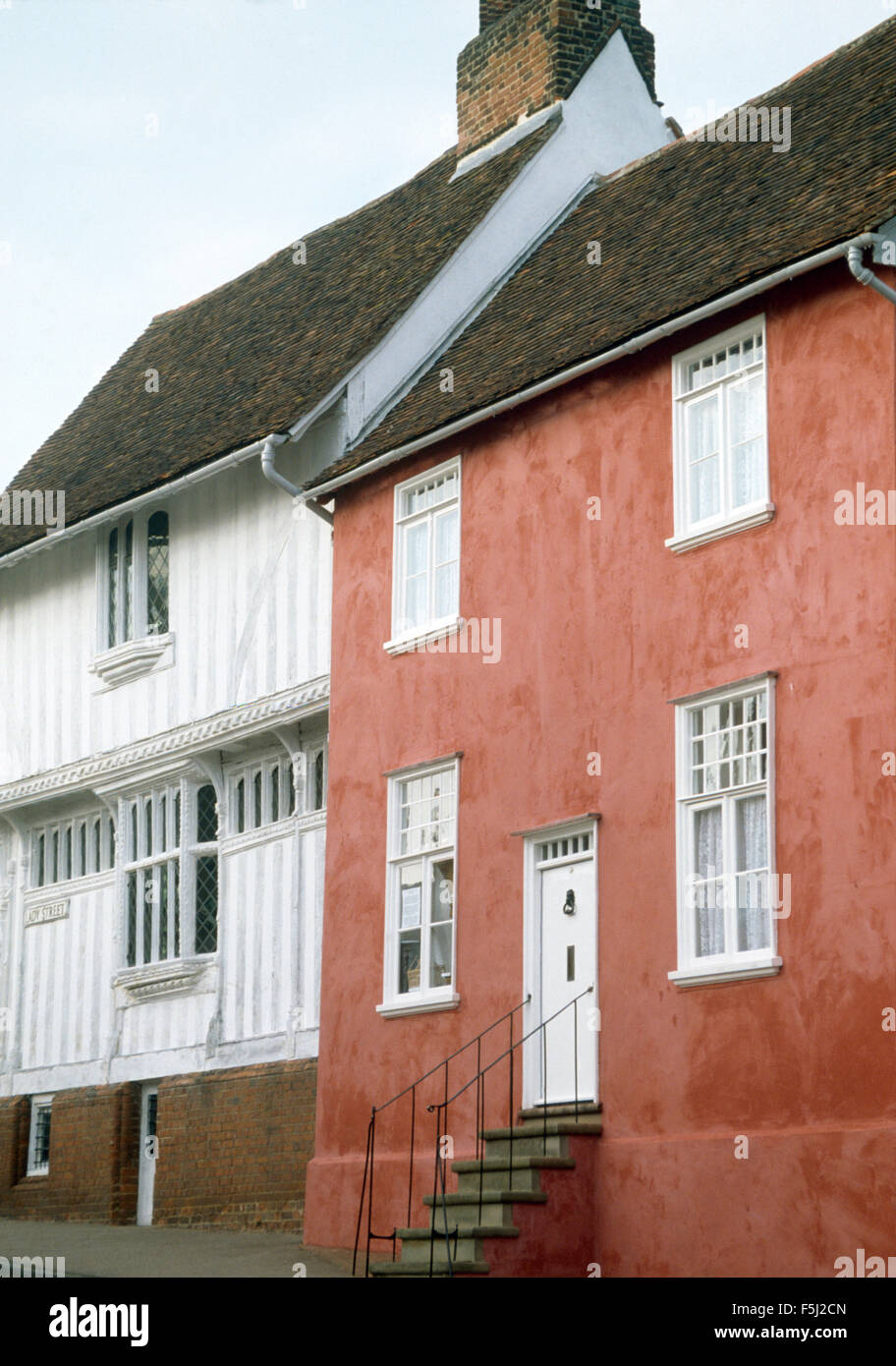 Exterior of terracotta and white painted houses in a Suffolk town Stock ...