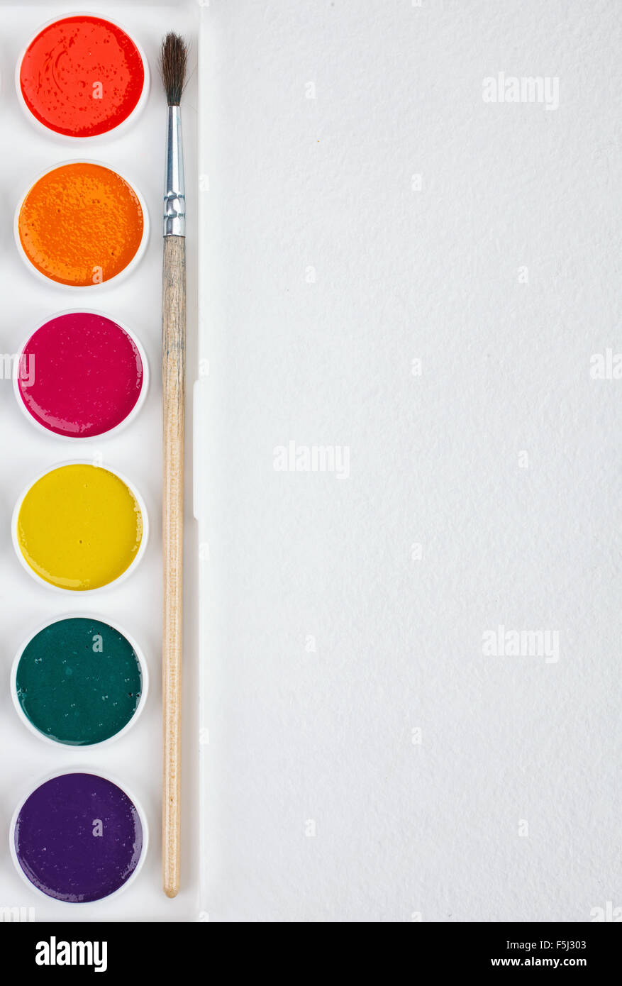 paints for painting and brush on blank white paper sheet Stock Photo ...