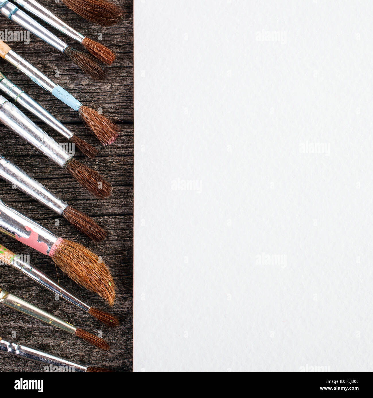 brushes for painting and blank white paper sheet Stock Photo - Alamy
