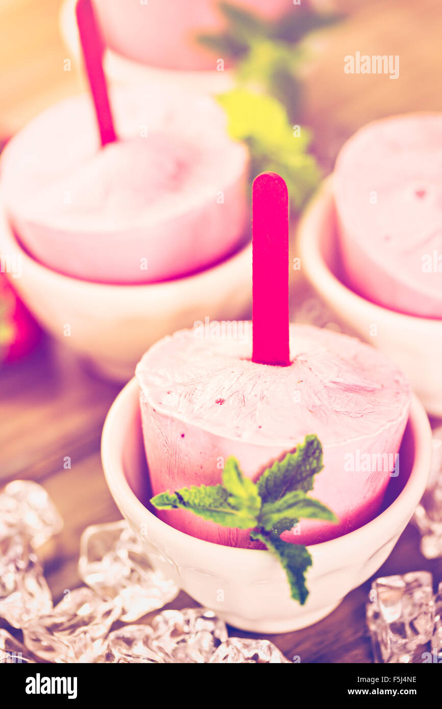 Homemade strawberry popsicles made in plastic cups Stock Photo - Alamy