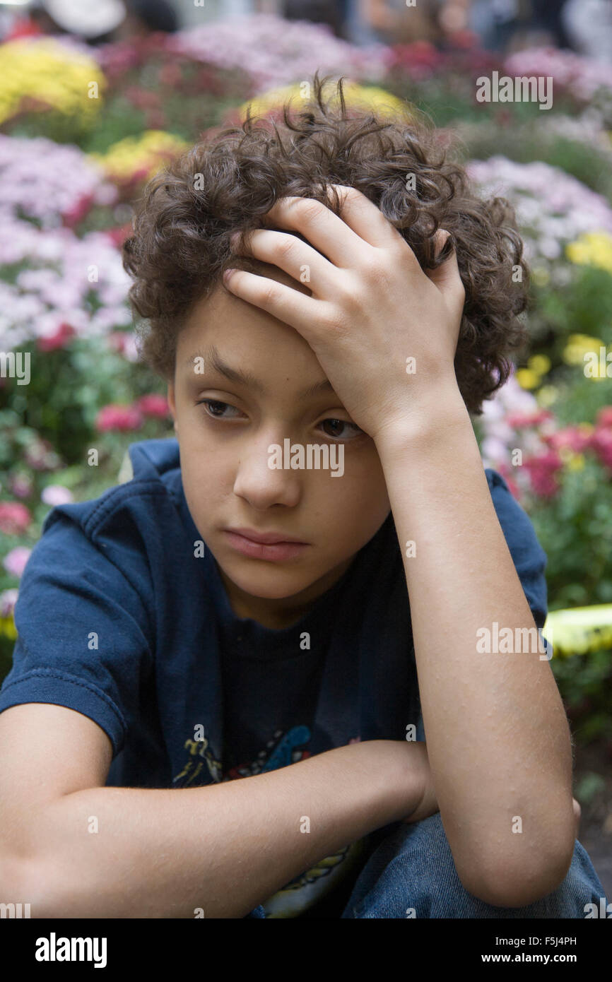 Young boy with a concerned look on his face Stock Photo - Alamy