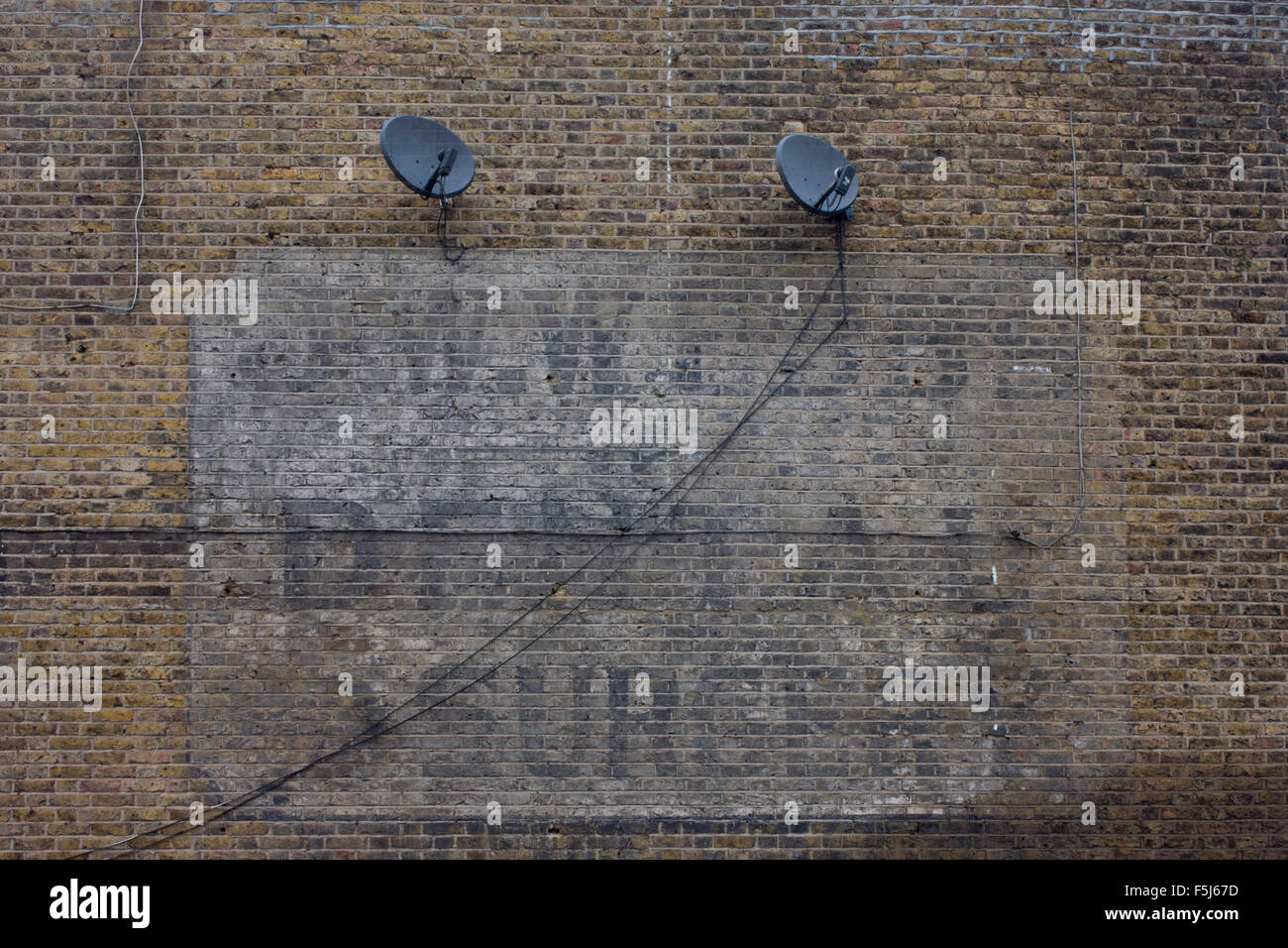 Advertising on brick wall hi-res stock photography and images - Alamy