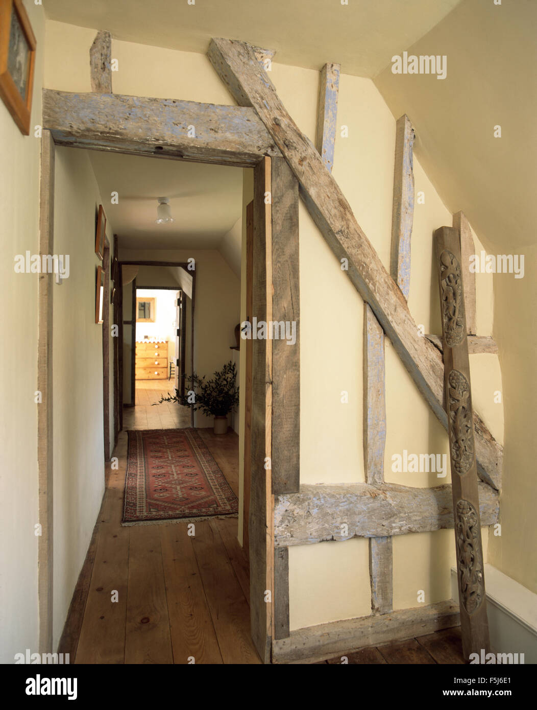 View of corridor with rustic beamed walls in a country cottage Stock ...