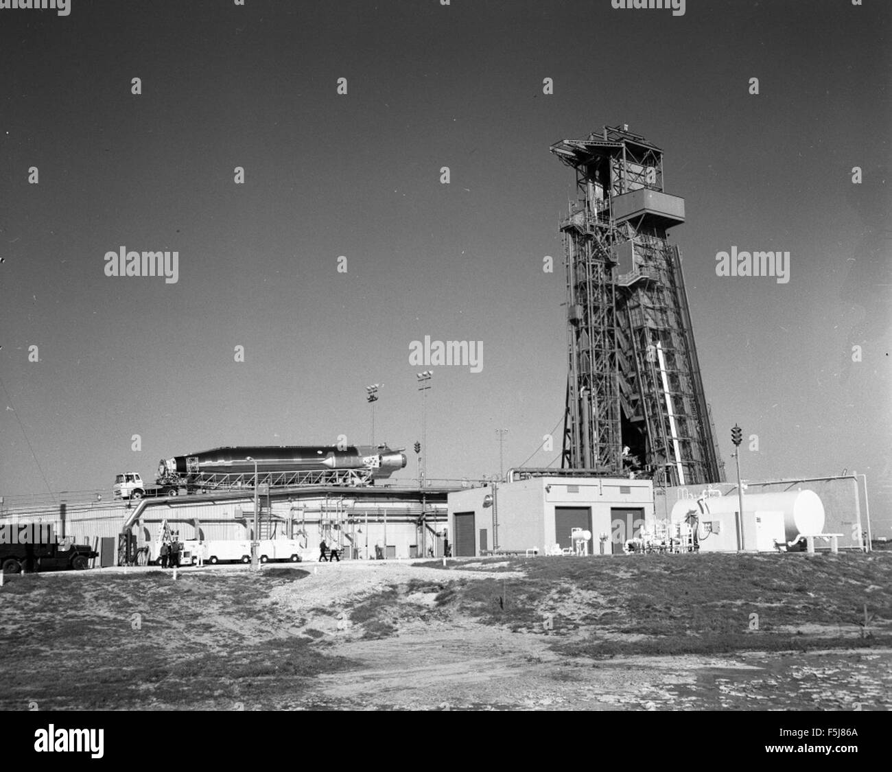 The Atlas missile system being erected in its launch tower as part of ...