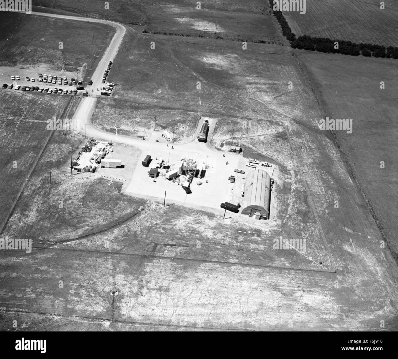 The Atlas missile is being prepared at Schilling AFB, with a team of ...