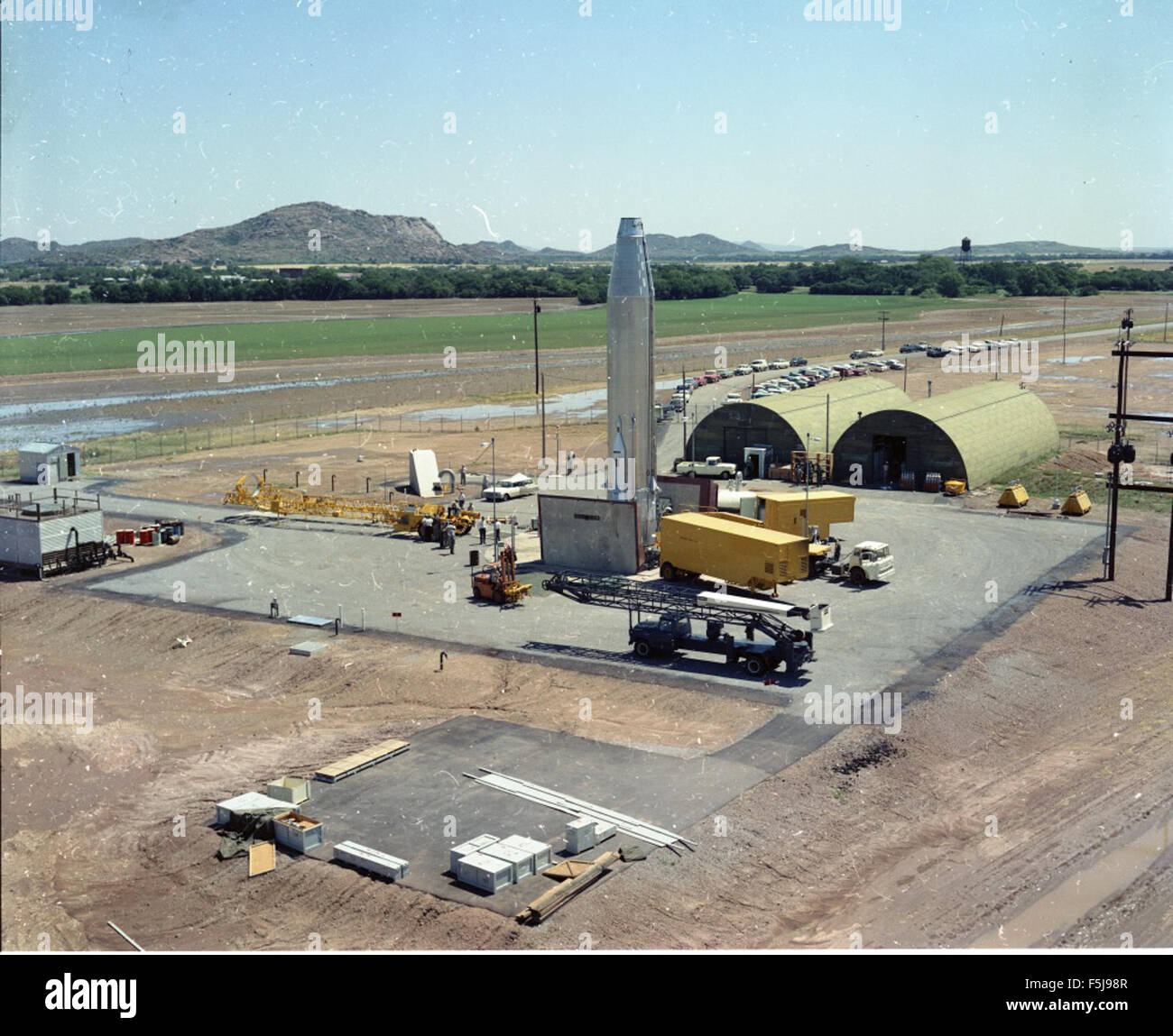 An Atlas missile is positioned in its silo, ready for deployment. The ...