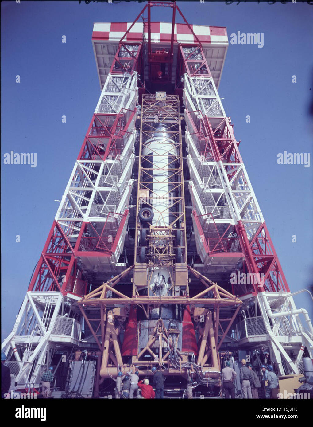 This image shows the Atlas 10A missile being erected on its launch ...