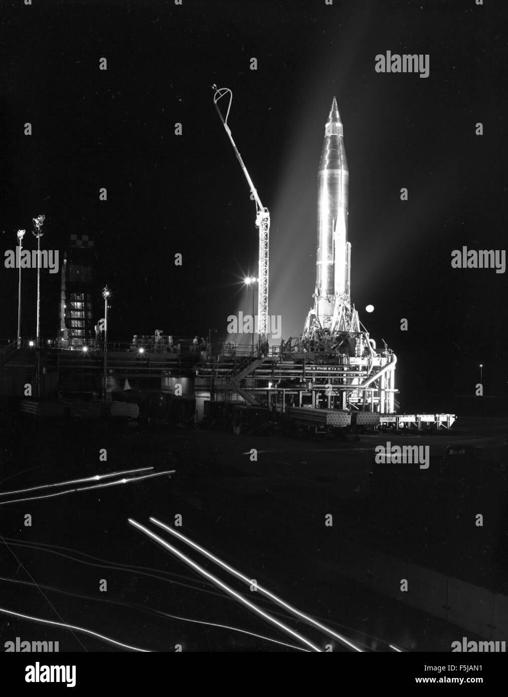 A night photograph showcasing the Atlas 12B missile positioned on its ...