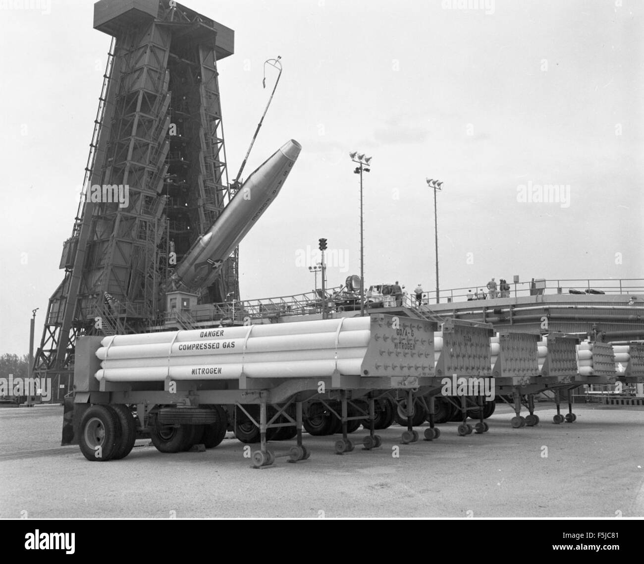 The image shows the mating and erection process of the 16F missile ...