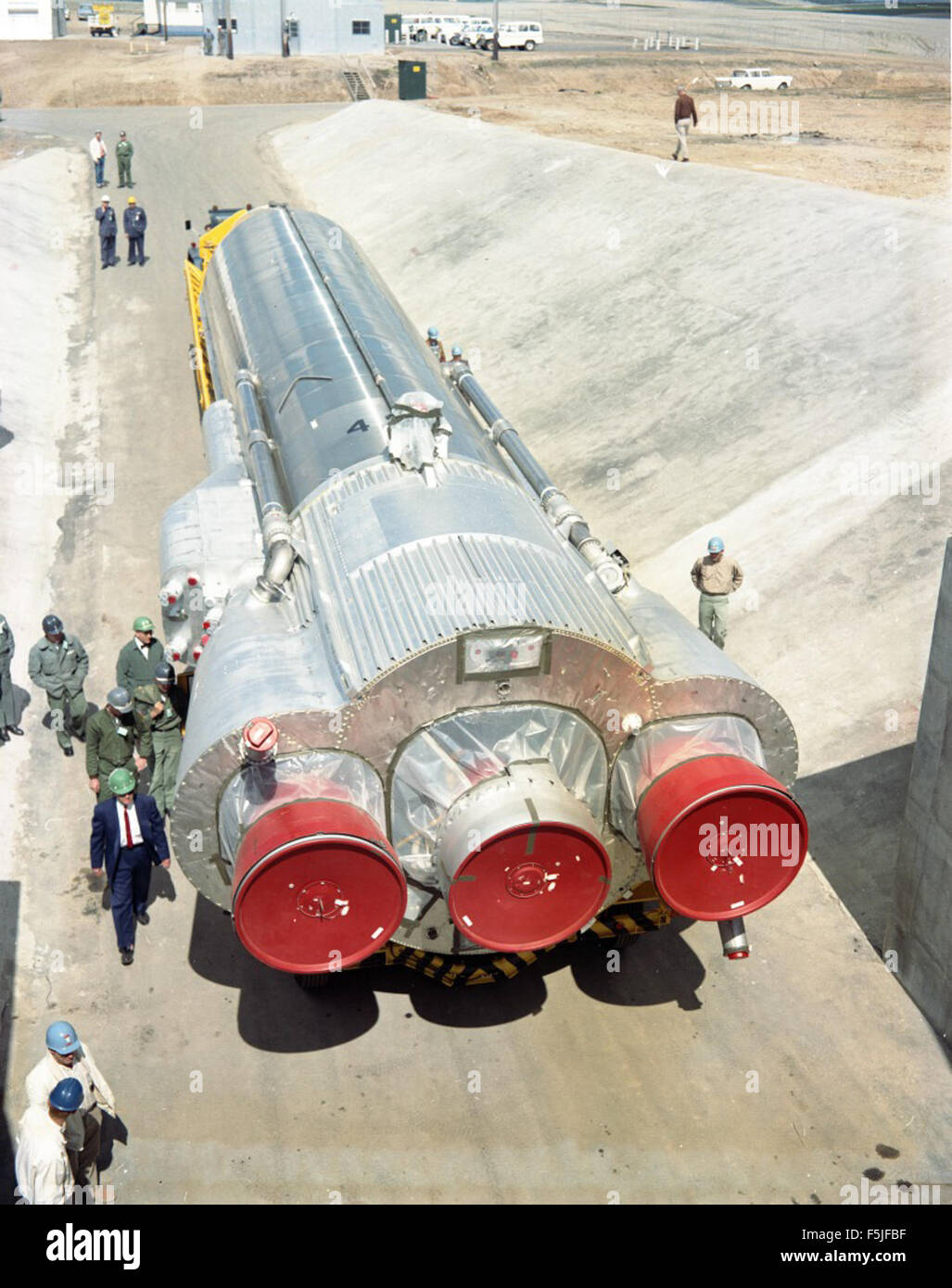 This image shows the Atlas 37E missile being backed down a ramp into a ...