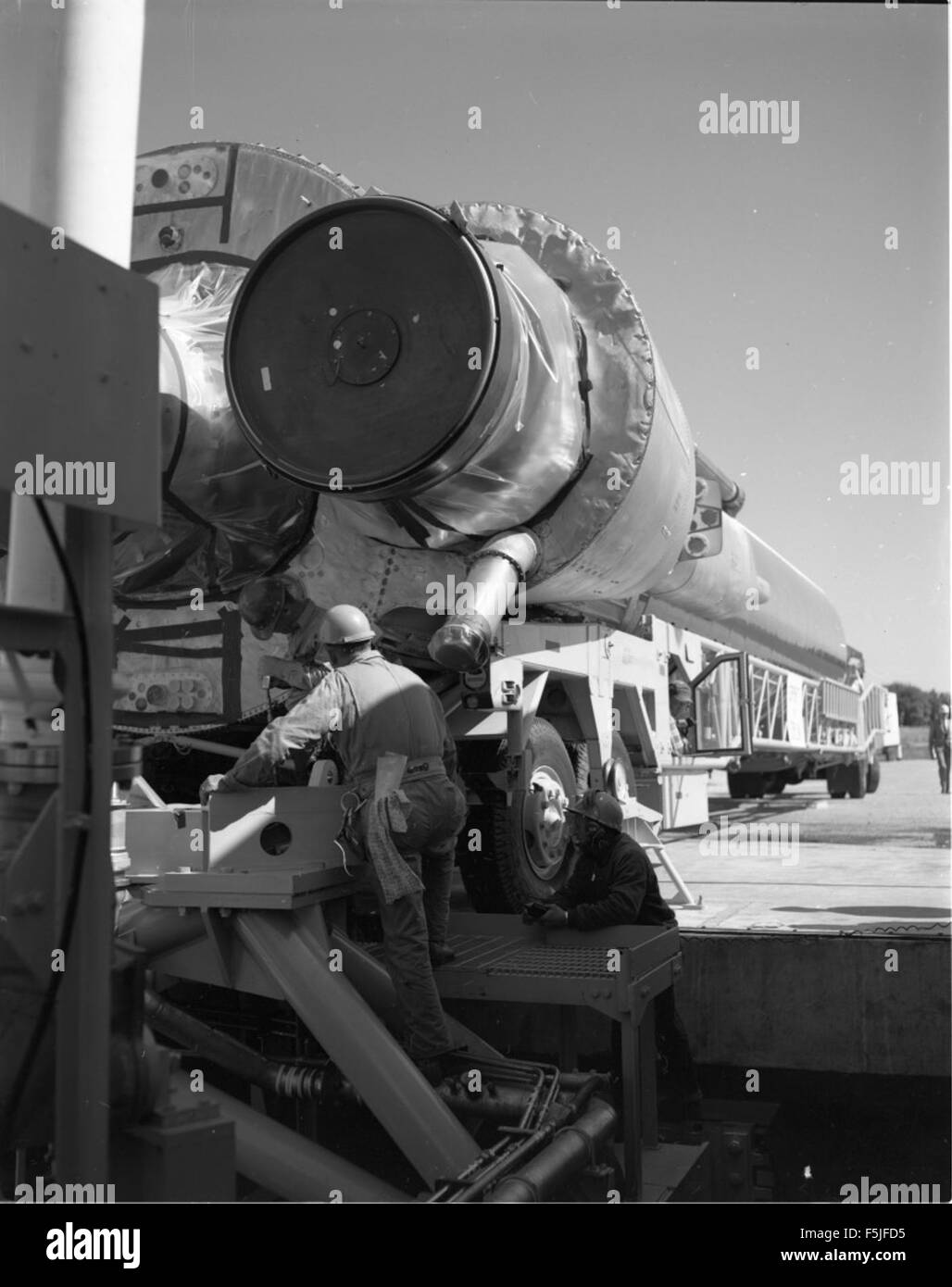 This image shows the Atlas missile being placed in a silo, part of the ...