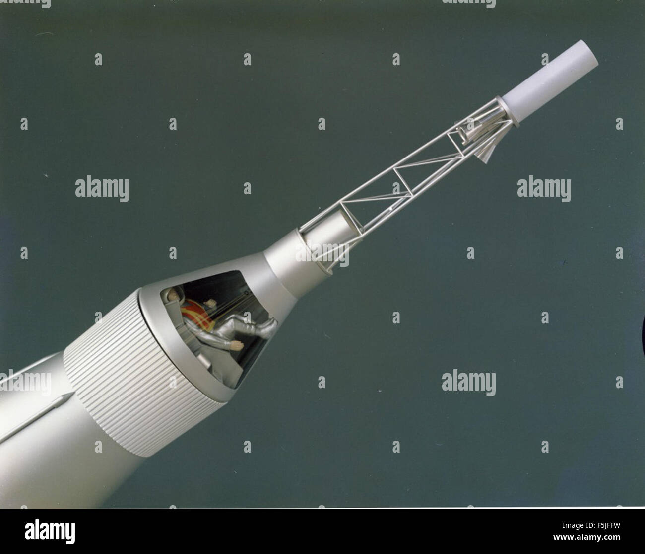 This close-up image features a scale model of the Mercury spacecraft ...