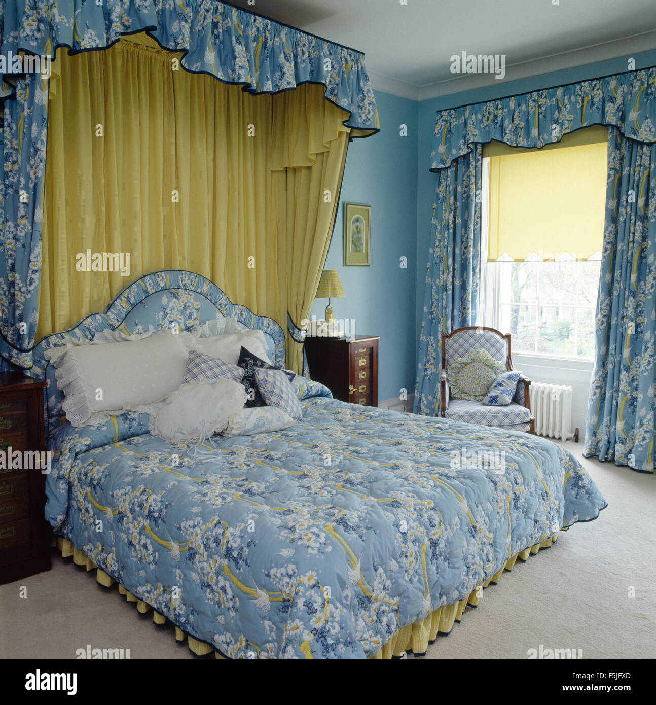 Blue drapes with yellow lining on half tester bed with a co-ordinating ...