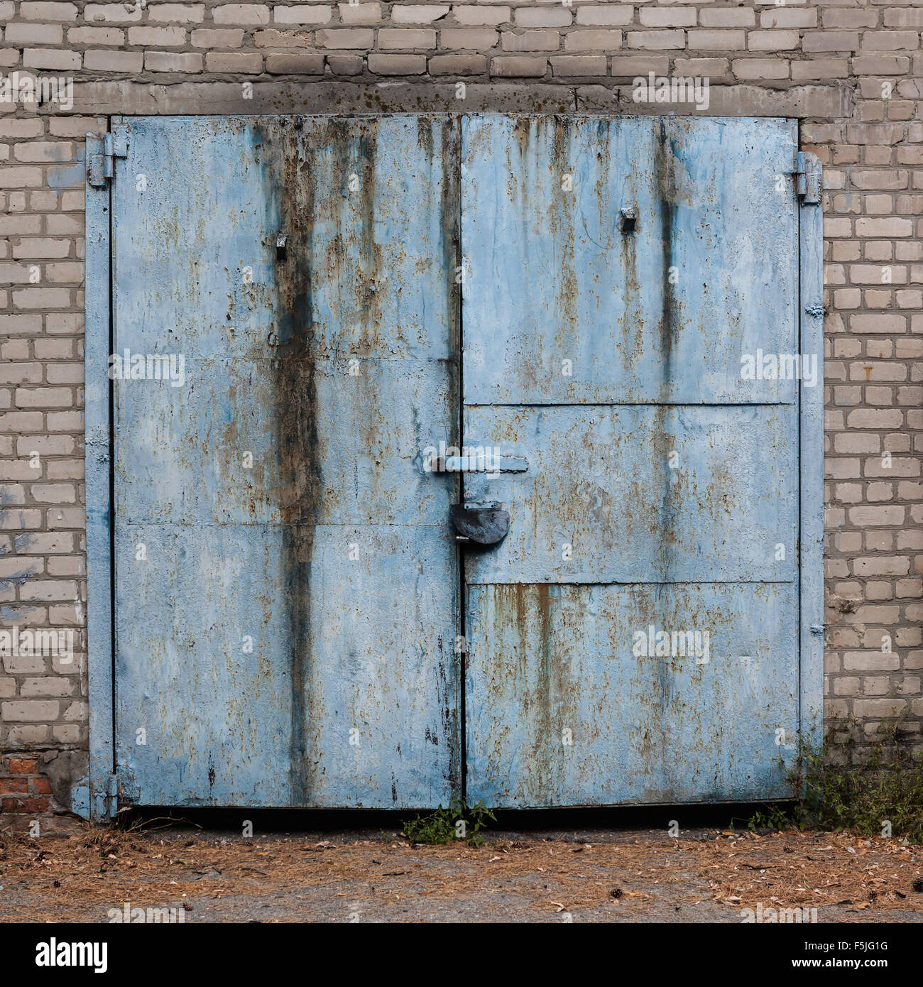 This is old weathered painted garage doors Stock Photo - Alamy