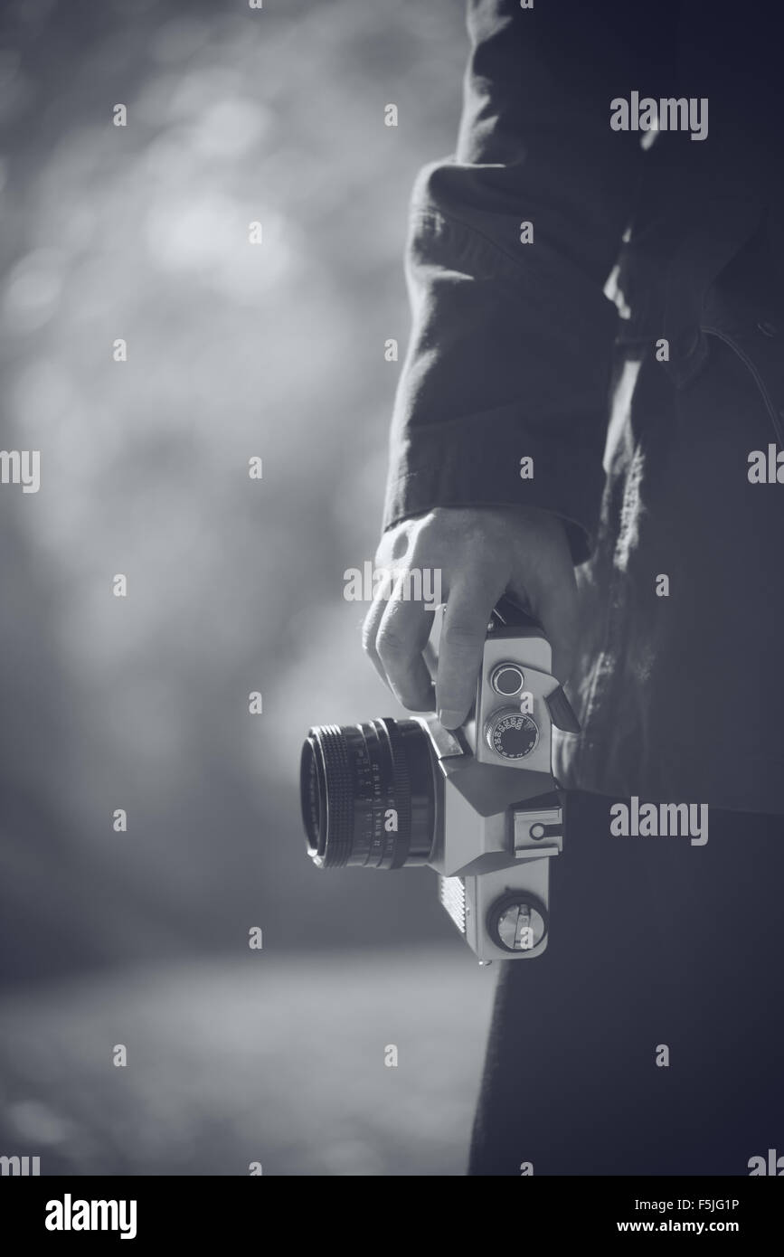 Hipster female photographer exploring autumn nature landscapes and ...