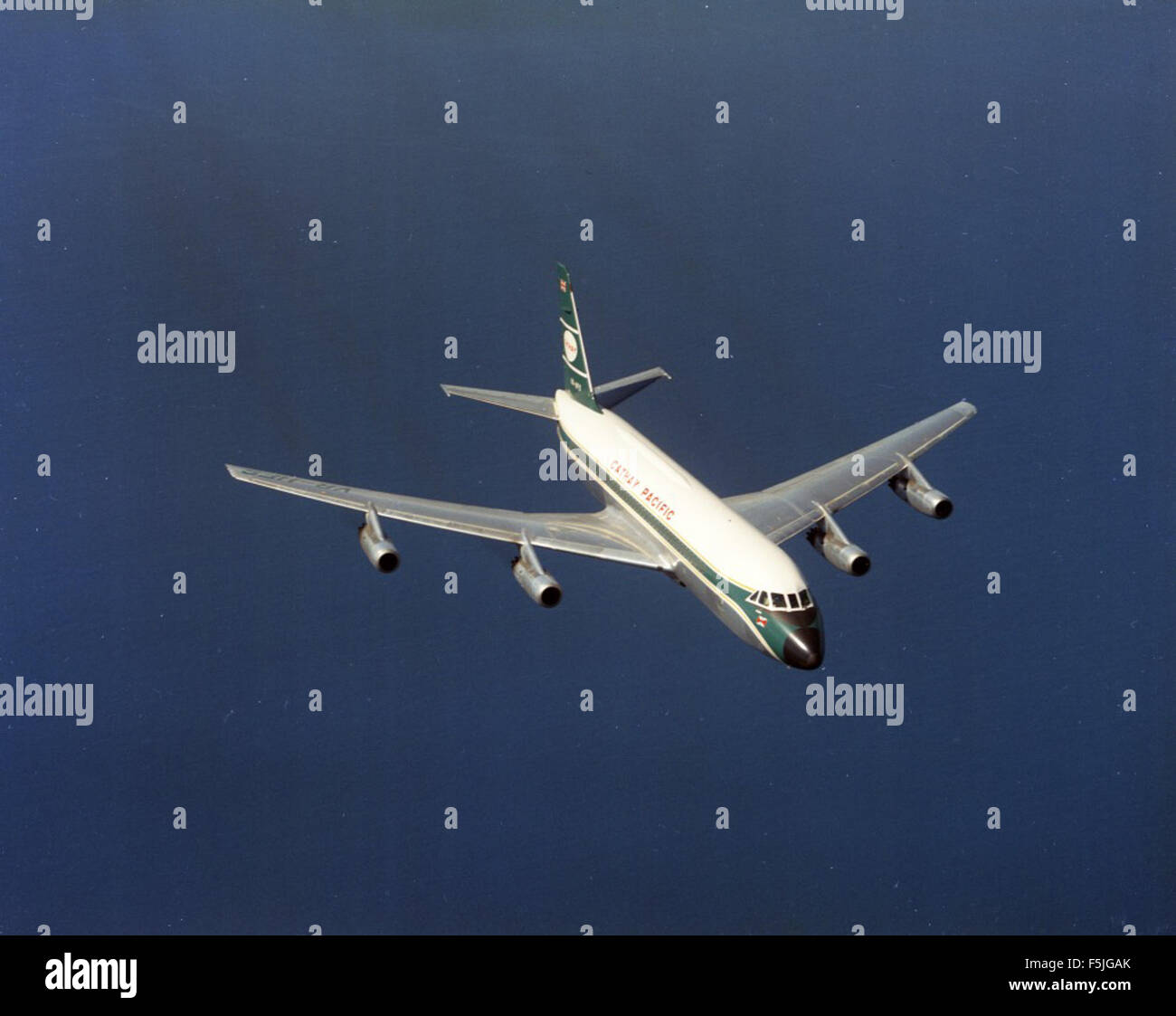 The Convair 880, registration 163-62, is shown in flight with Cathay ...