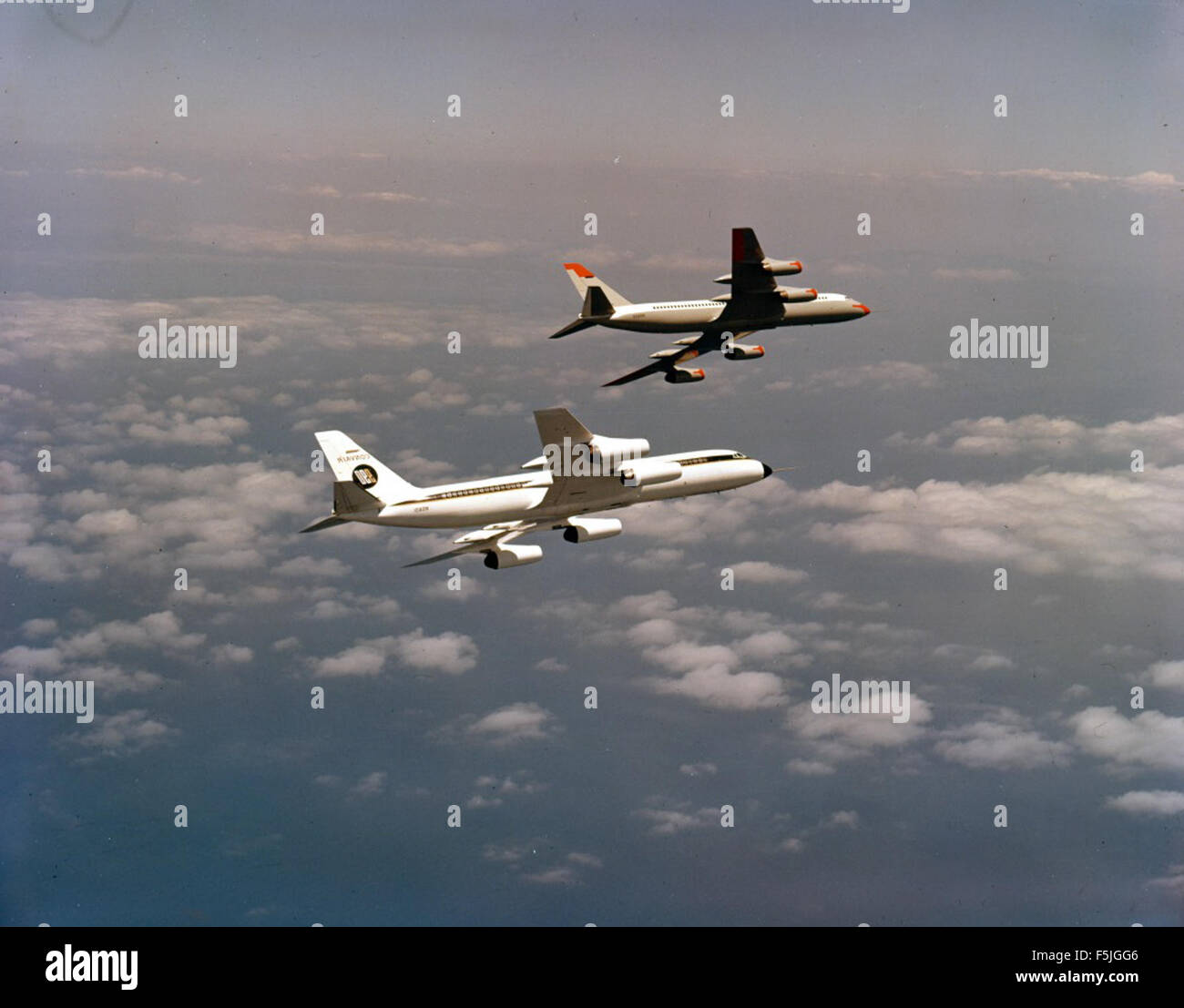 A photograph of the Convair 990 F-6 aircraft in formation flight ...