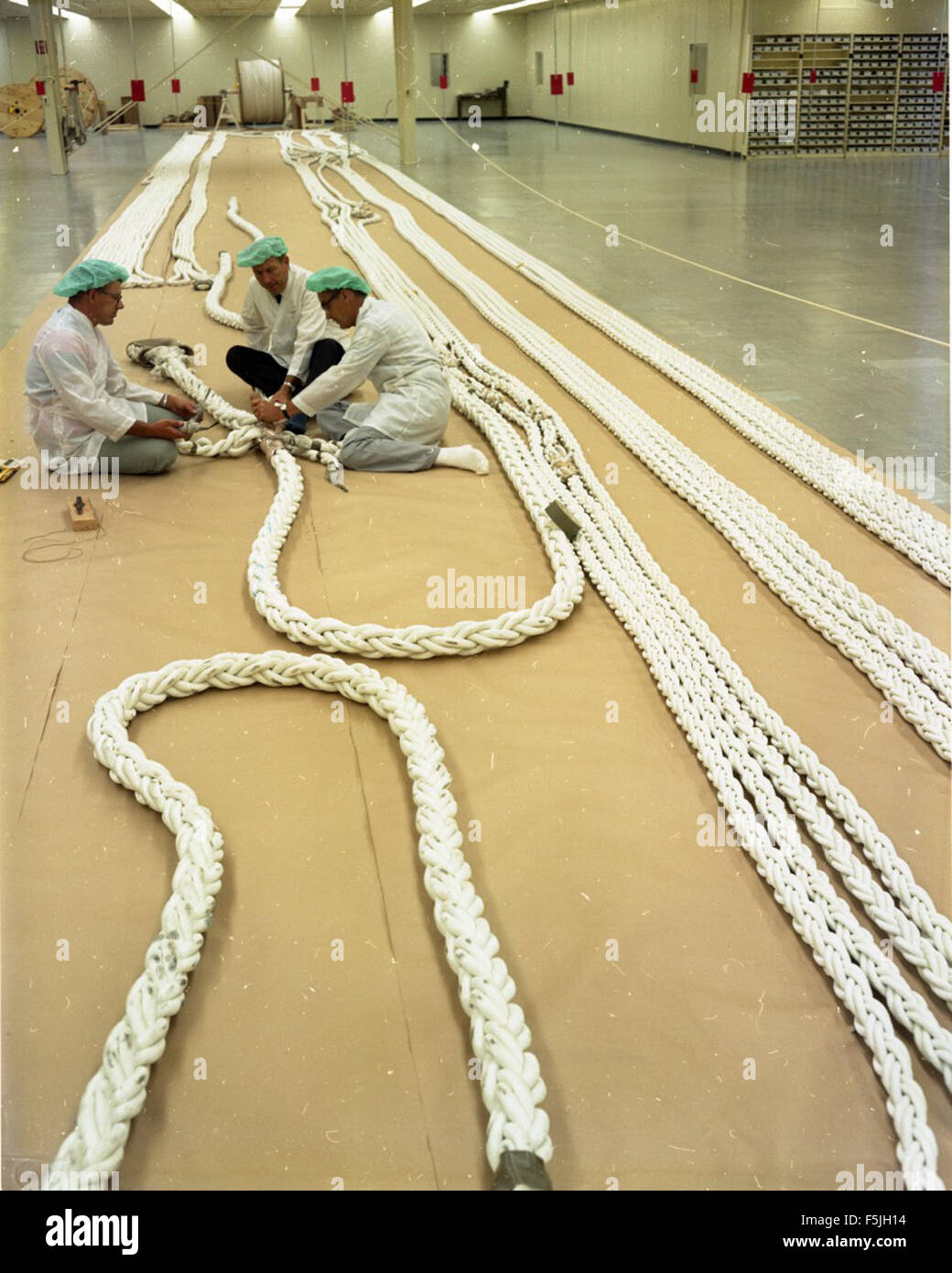 Photograph detailing the splicing of buoy mooring lines inside Building ...