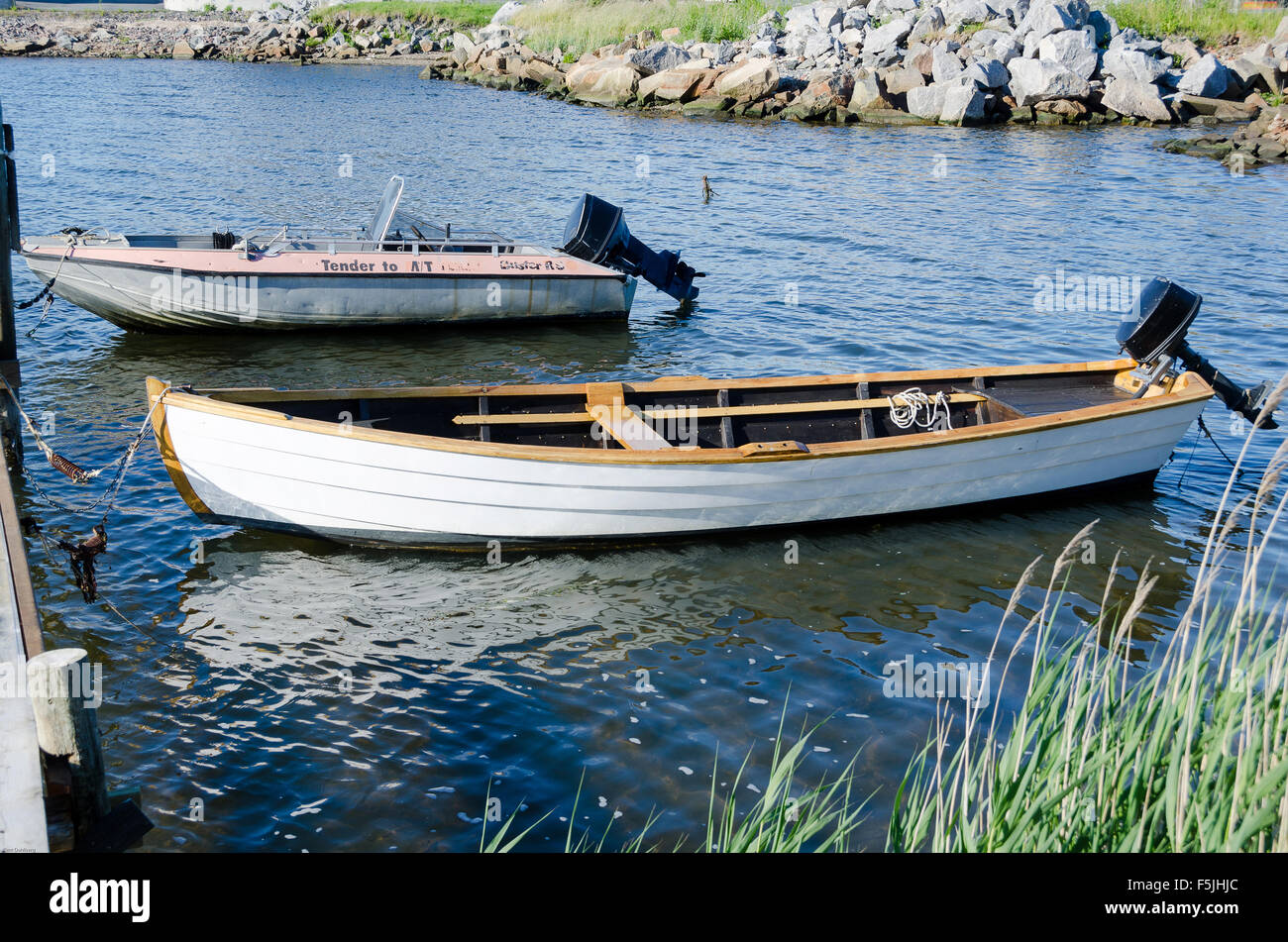 old boat in the water with one old engine back Stock Photo - Alamy