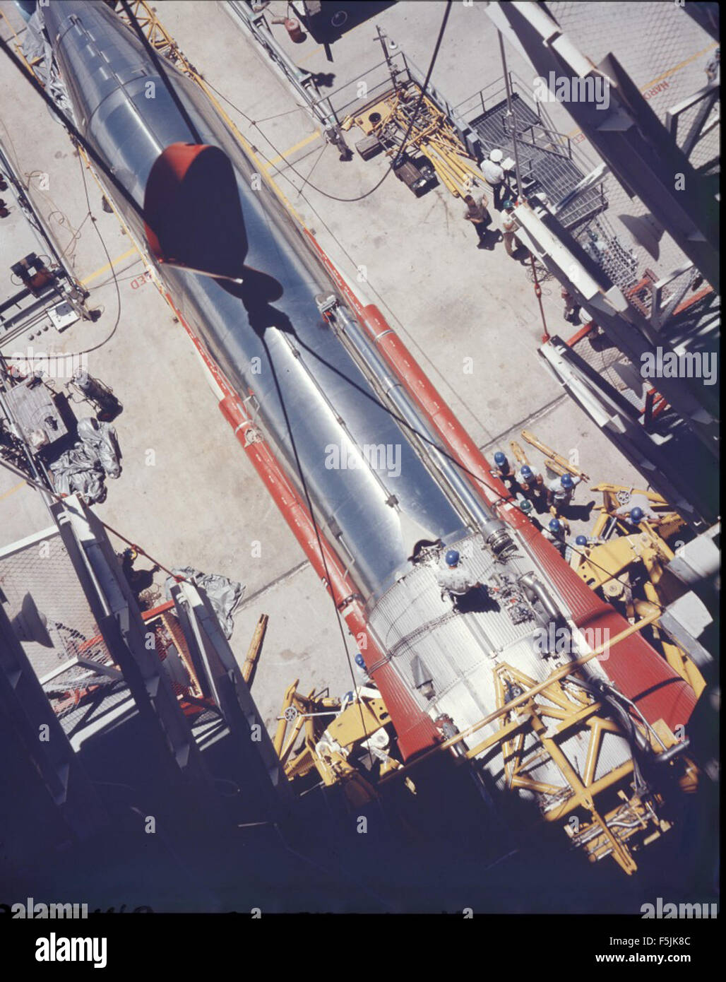 The Atlas 6A missile is shown during the mating process at Pad 14 at ...