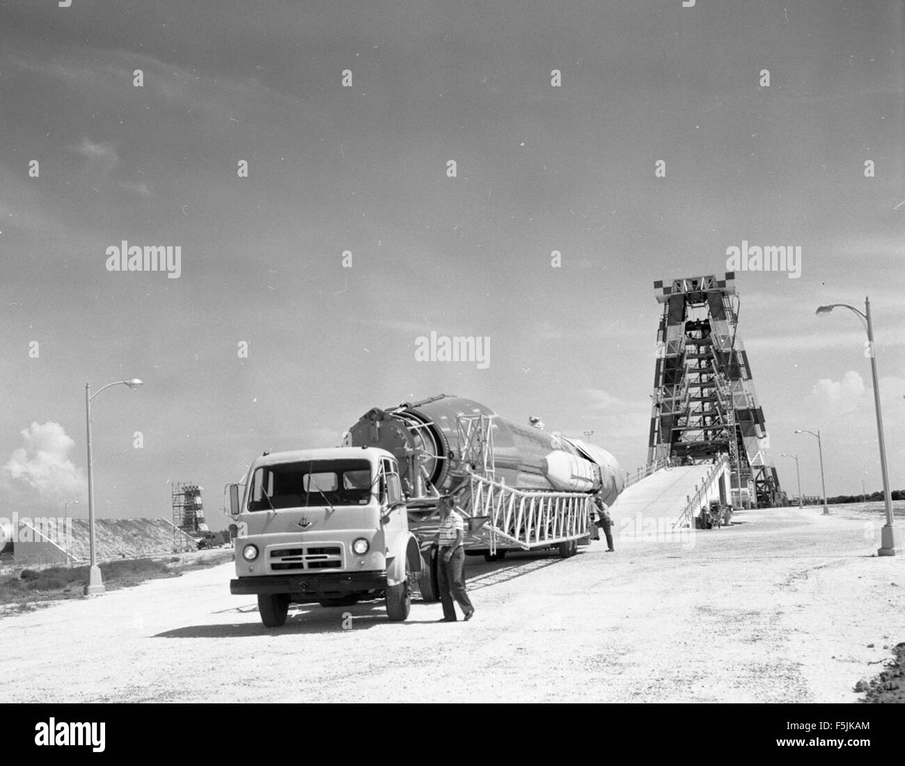 The Atlas 6B missile arrives at Pad 13, accompanied by its transport ...