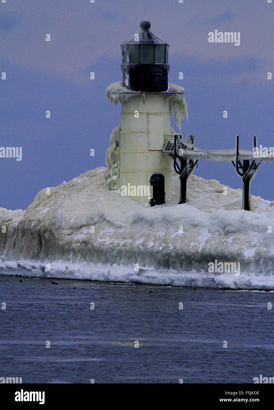 Beautiful winter scene the with St Joseph lighthouse covered in snow in ...