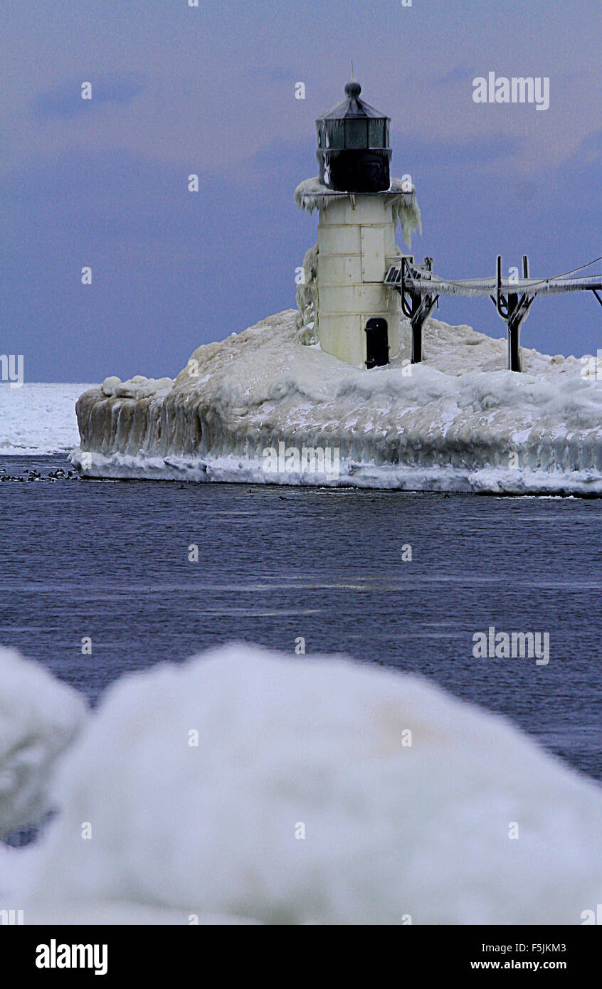 Beautiful winter scene the with St Joseph lighthouse covered in snow in ...