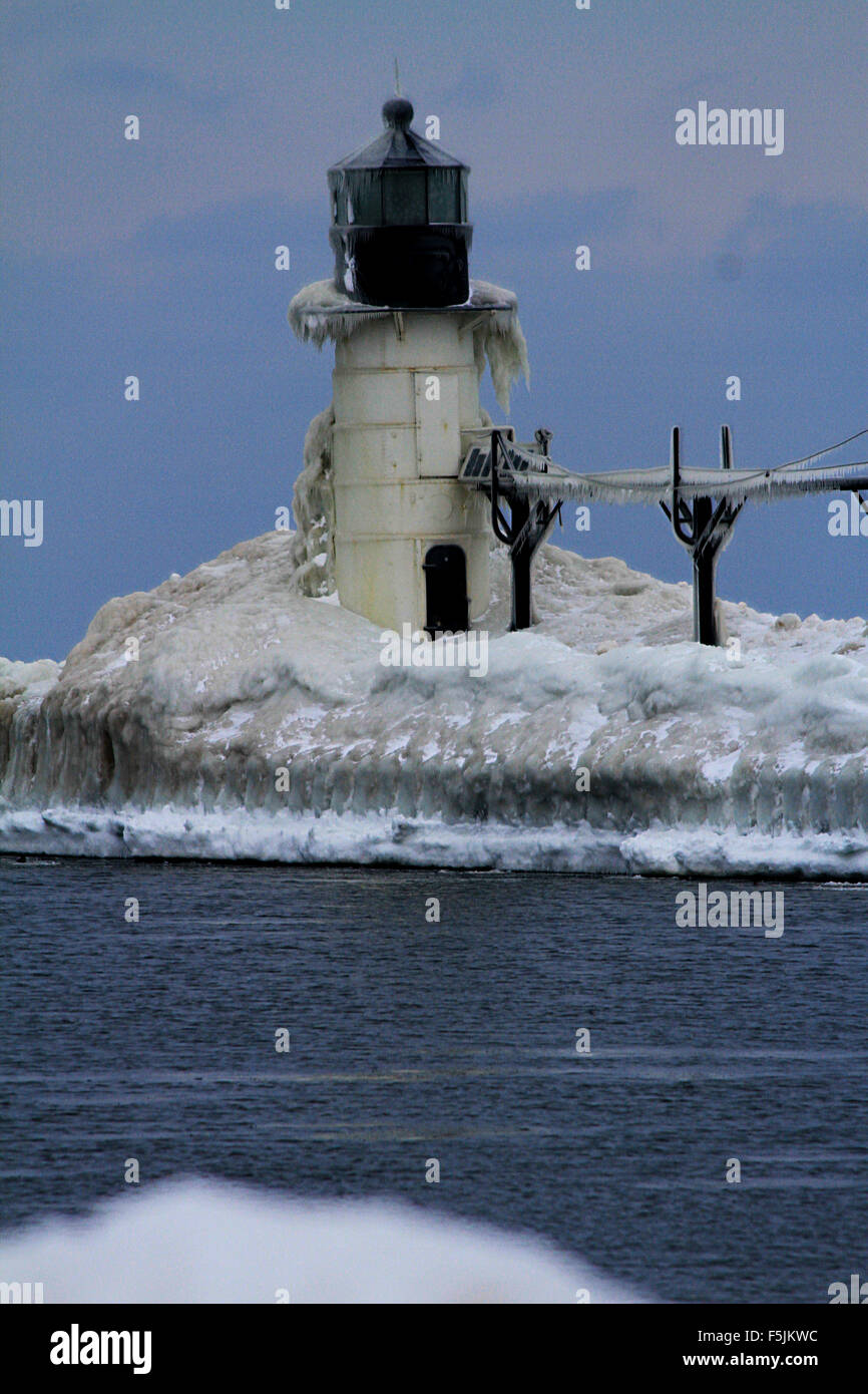 Beautiful winter scene the with St Joseph lighthouse covered in snow in ...