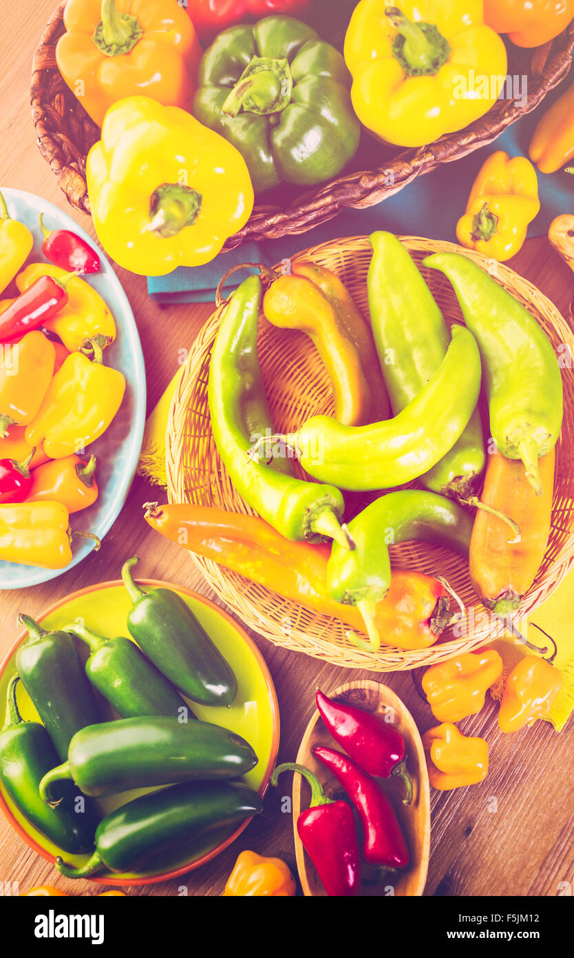 Variety of fresh organic peppers on the table Stock Photo - Alamy